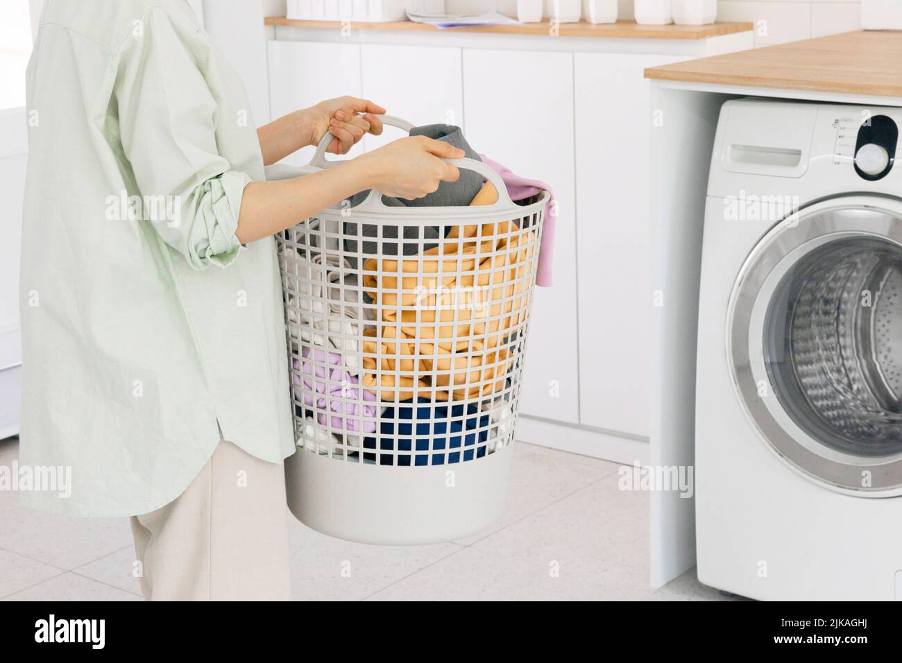 aesthetic laundry concept Laundry basket filled with clothes Stock Photo - Alamy