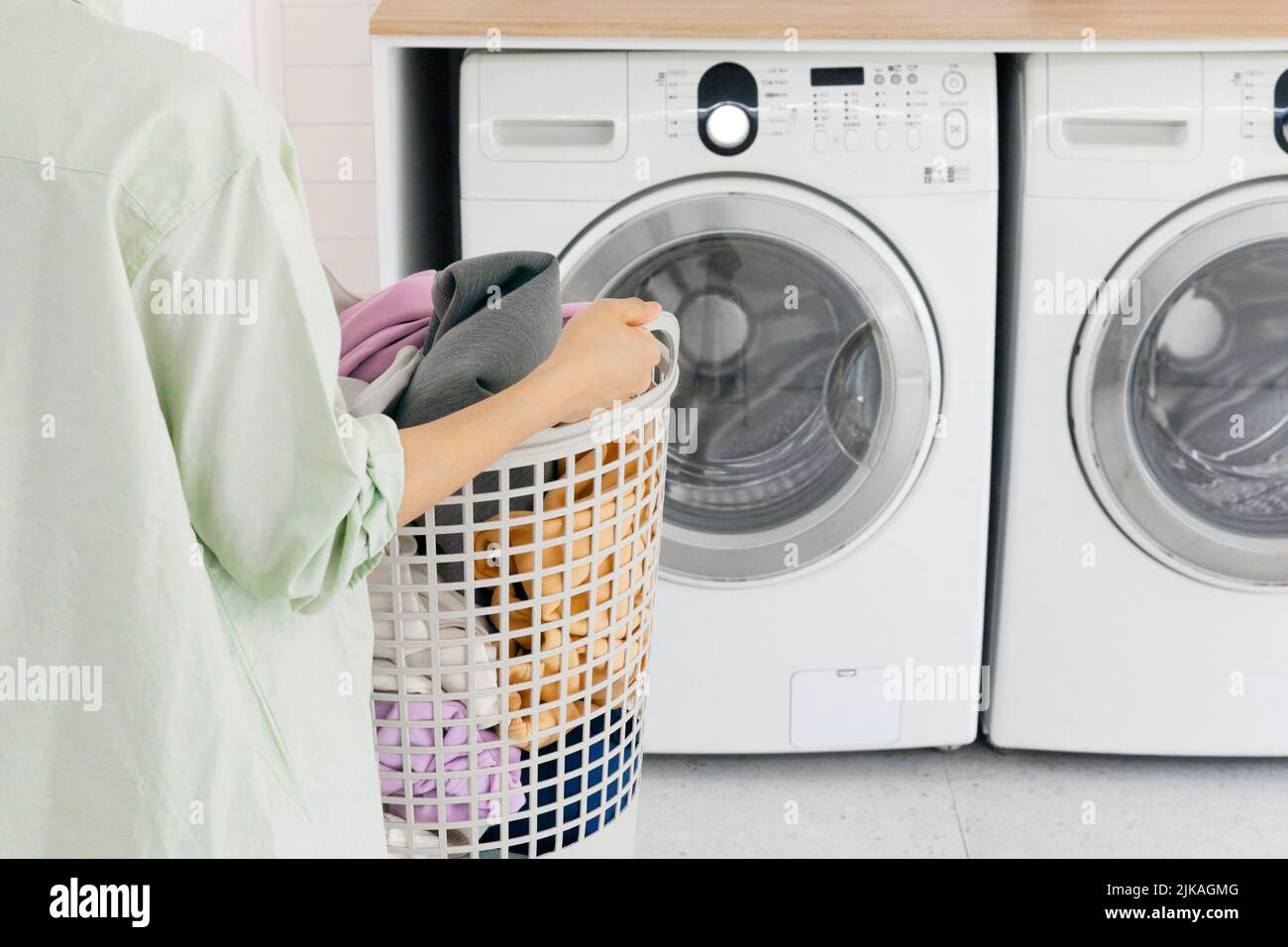 aesthetic laundry concept Laundry basket filled with clothes Stock Photo - Alamy