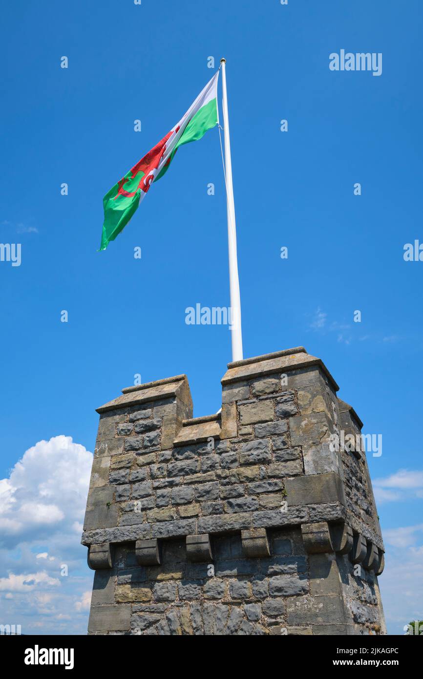 The royal crest flag flying on the tower of the old stone Keep. At ...