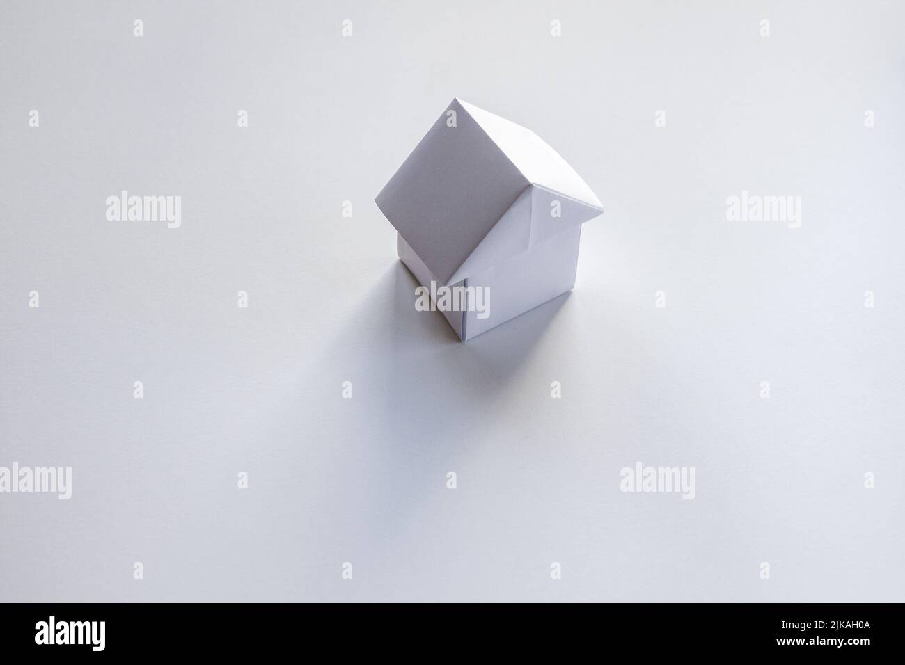 Paper house origami isolated on a blank white background Stock Photo ...