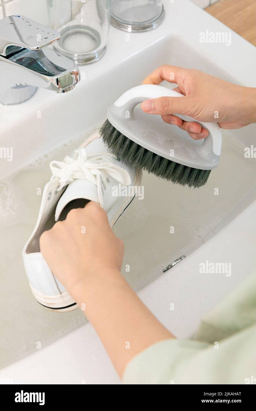 aesthetic laundry concept Washing sneakers Stock Photo - Alamy
