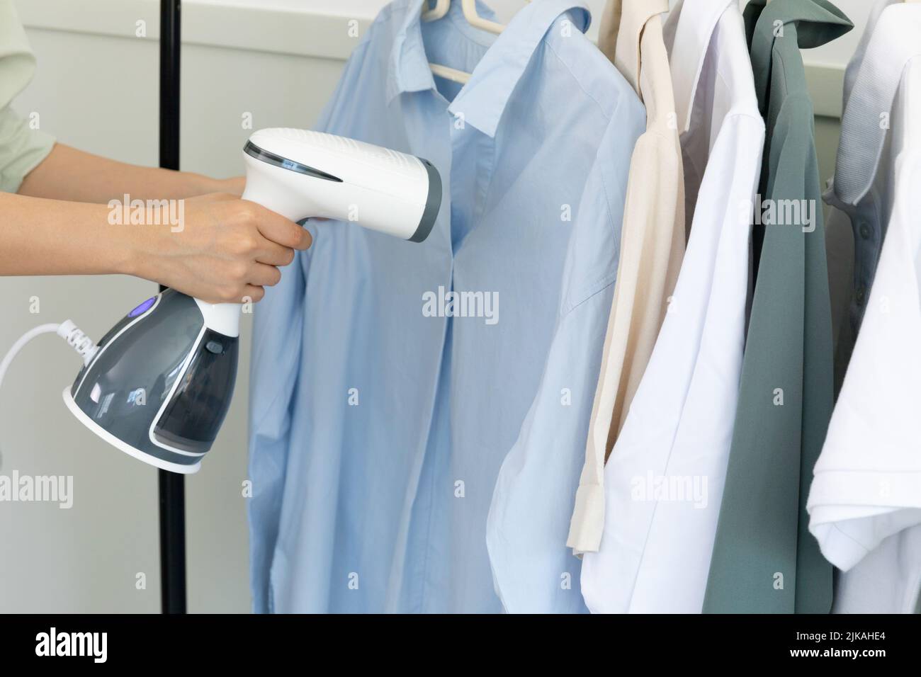 aesthetic laundry concept ironing clothes Stock Photo - Alamy