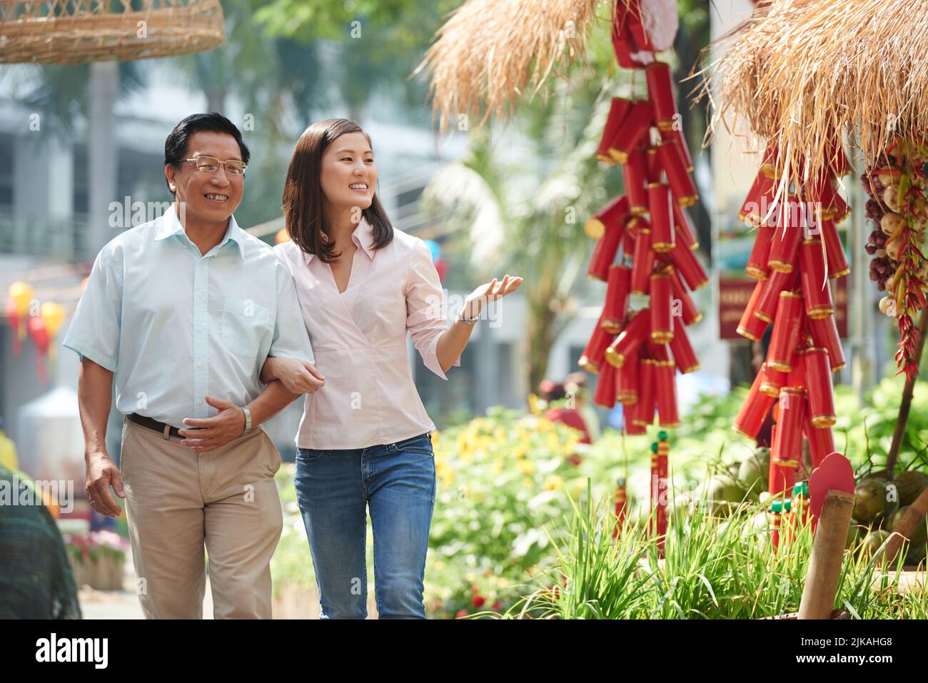 Vietnamese father and daughter walking outdoors during spring festival Stock Photo - Alamy
