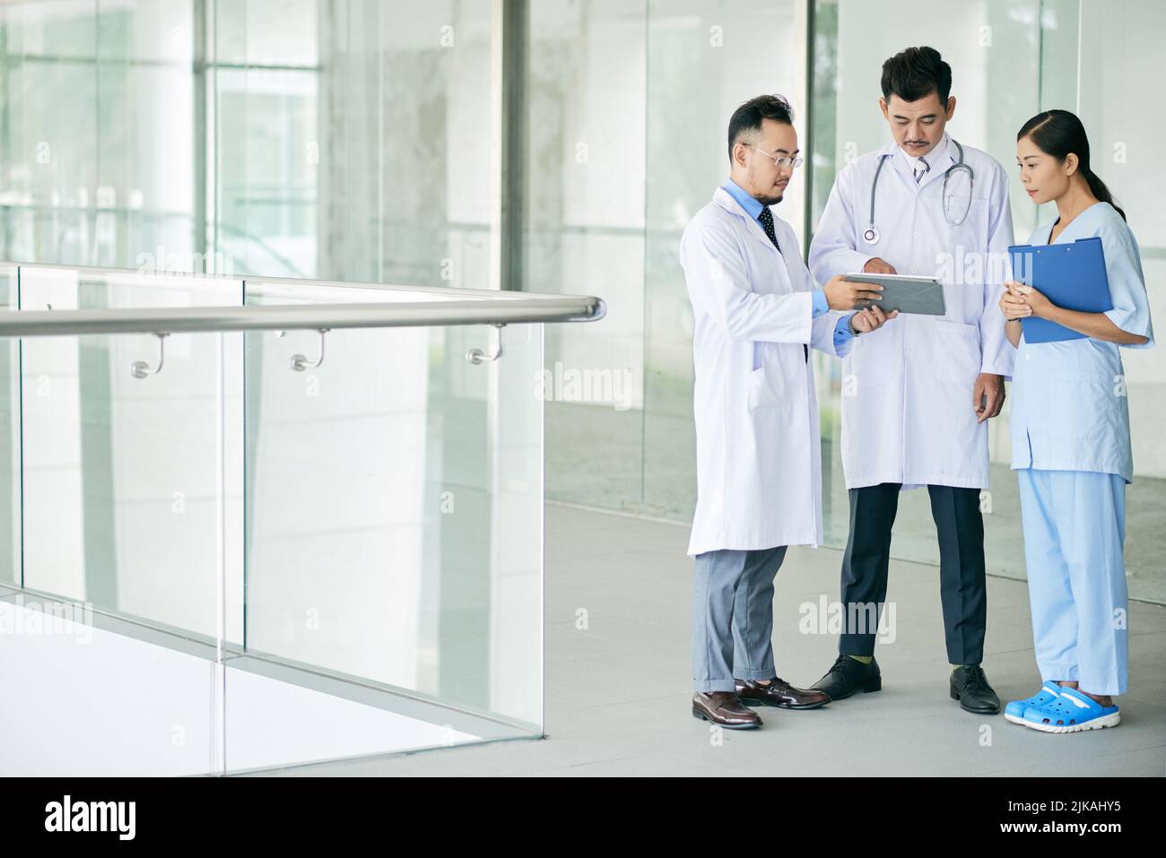Vietnamese doctors talking in the corridor of the hospital Stock Photo ...