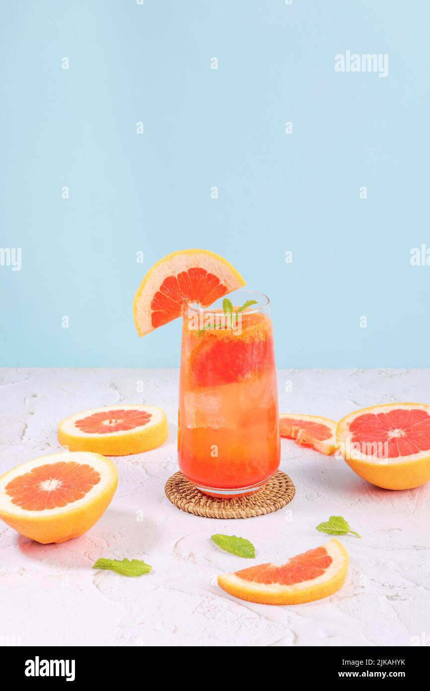summer background with grapefruit ade, juice drink with grapefruits ...