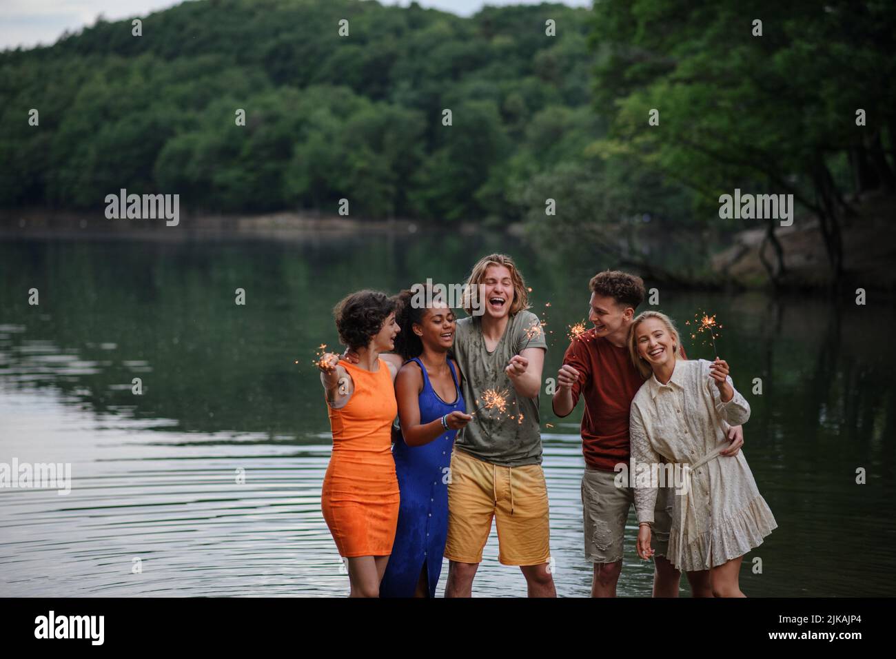 Group of friends celebrating sunset hi-res stock photography and images ...