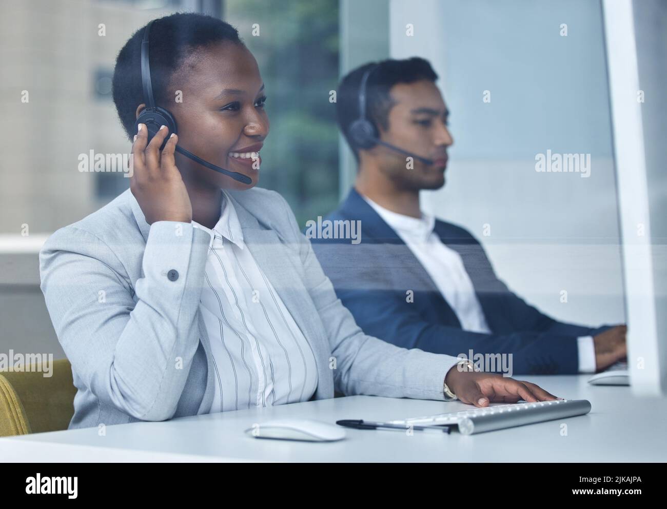 On a mission to help. two young call center agents working at their ...