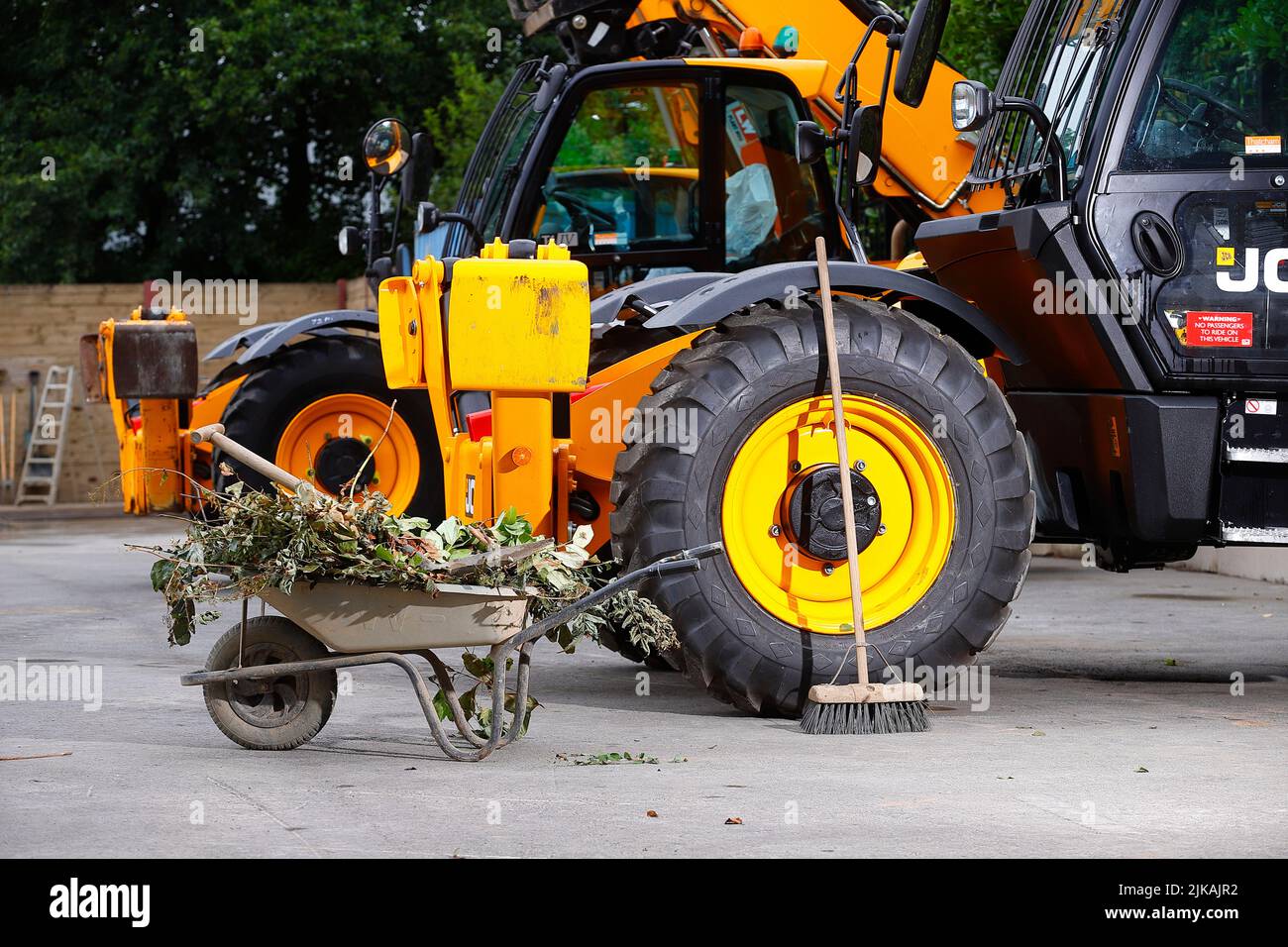 Wheelbarrow and broom hi-res stock photography and images - Alamy