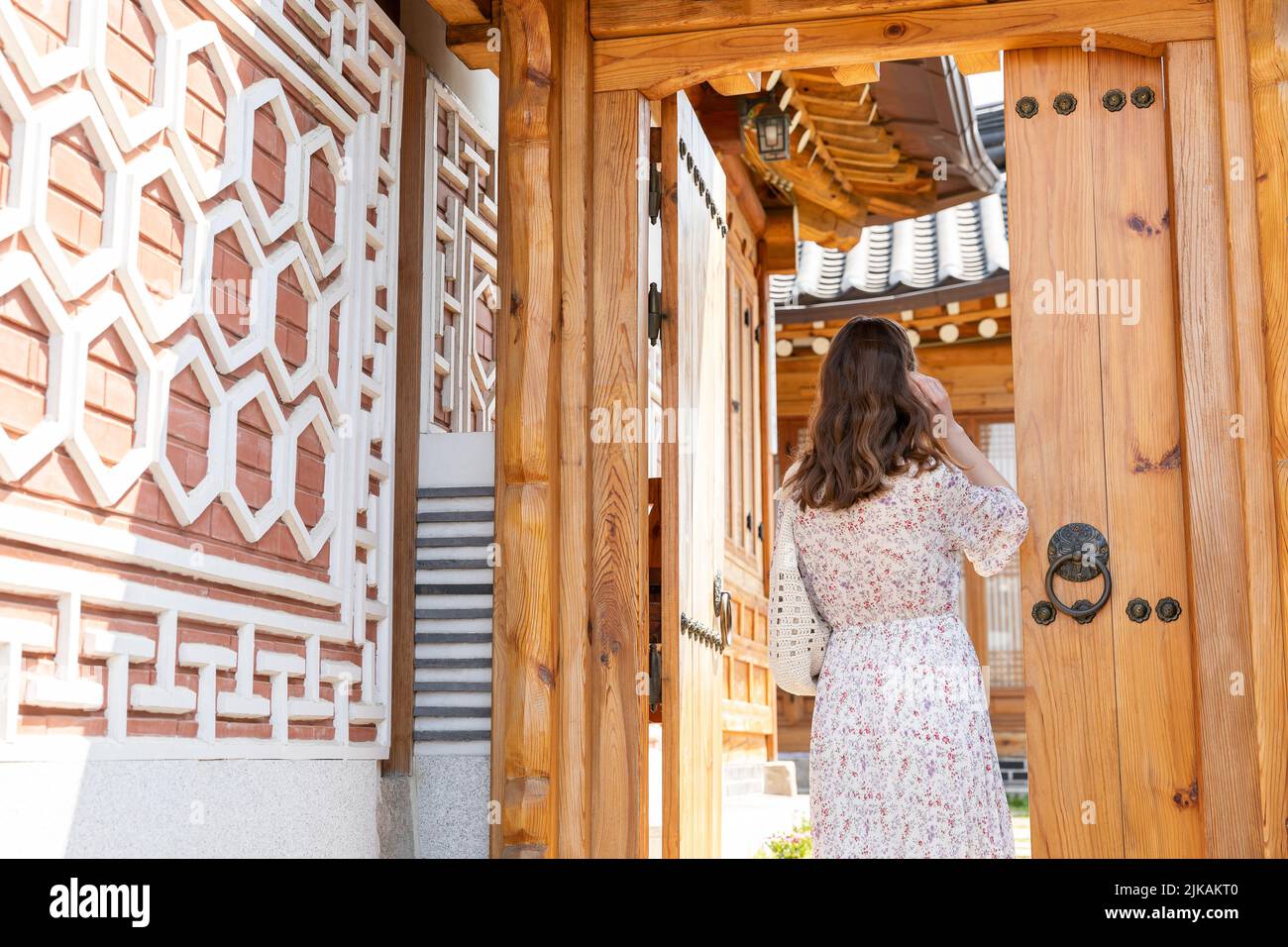 Woman rear opening door hi-res stock photography and images - Alamy