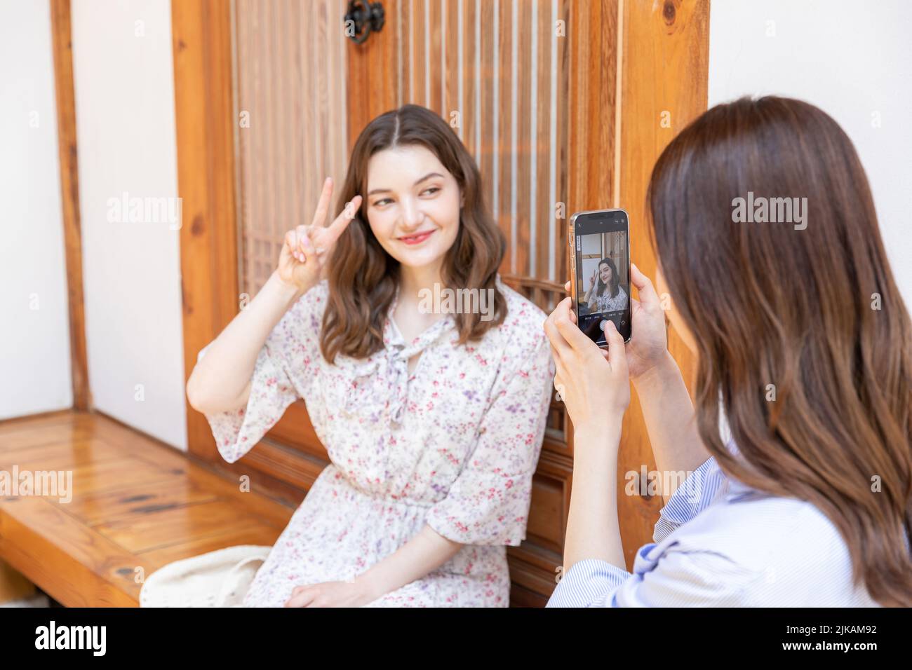 Experiencing Korean Traditions In Hanok Korean Girl Giving Souvenir To