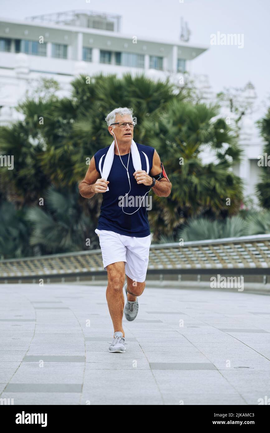 Portrait elderly retired man jogging hi-res stock photography and ...