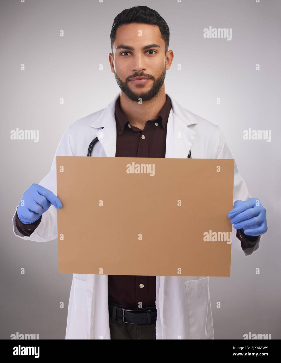 I hope you see this. a handsome young doctor standing alone in the ...