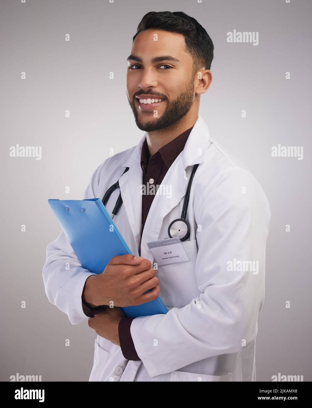 Im ready to save some lives. a handsome young doctor standing alone in ...