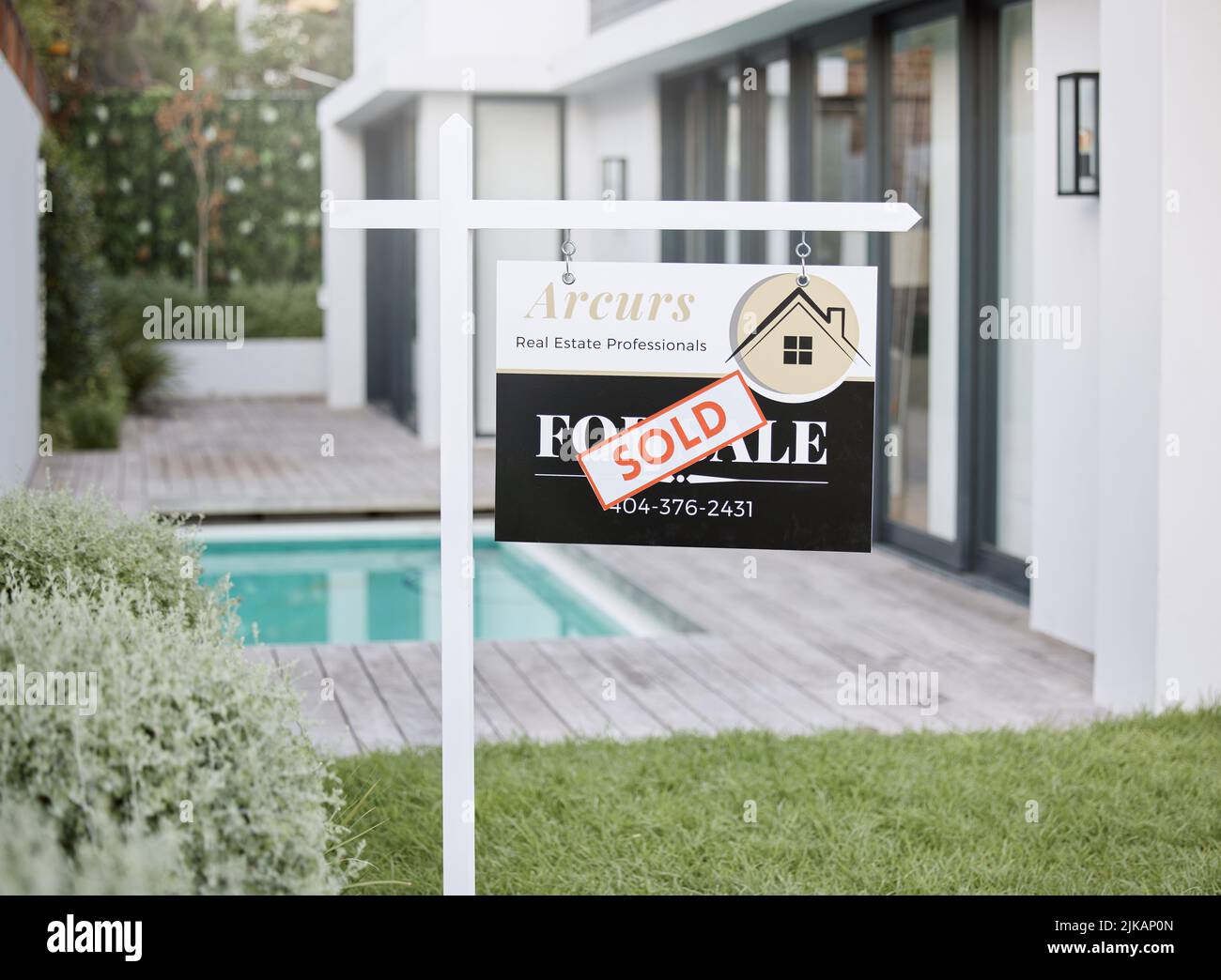 New beginnings. for sale sign with a sold sticker outside a house Stock ...