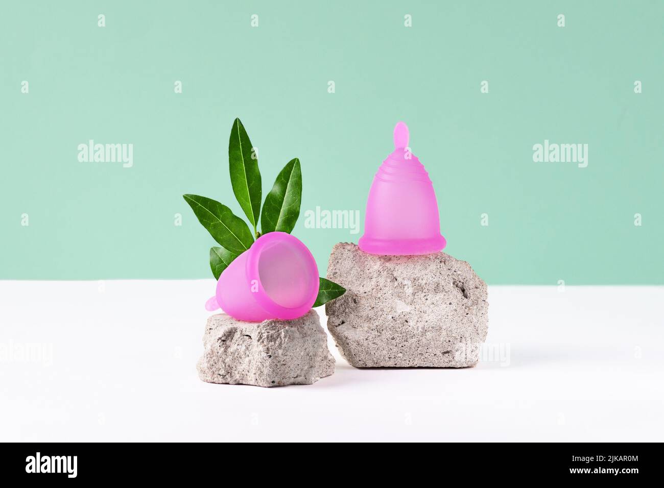 Pink menstrual cup. Women health, menstrual cup as a zero waste concept ...