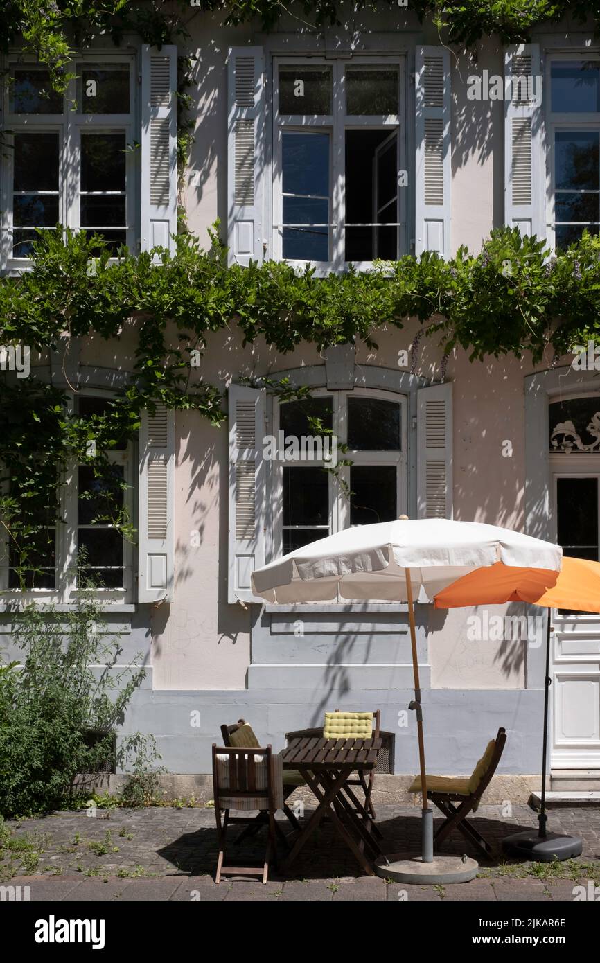 Atmospheric and romantic light pink painted facade of a house with ...