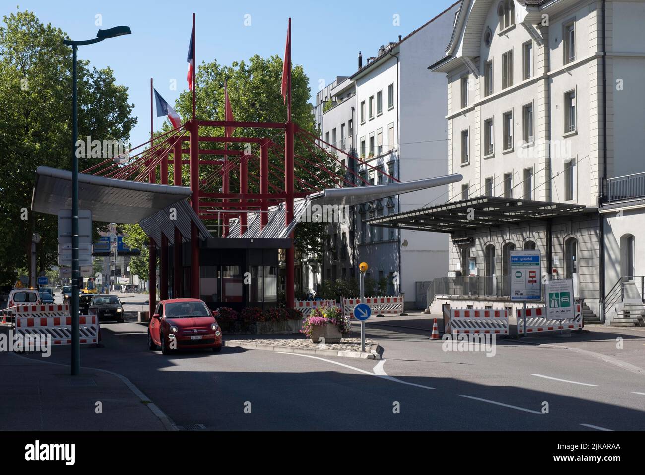 Red car passes the border checkpoint from Basel in Switzerland to Saint ...