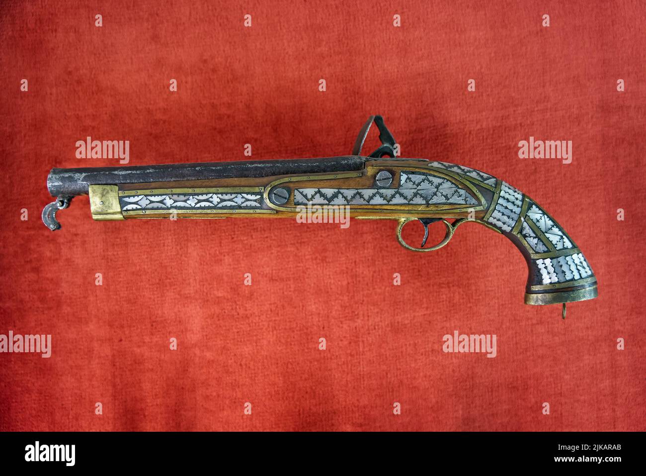 old gun on a wooden background Stock Photo - Alamy