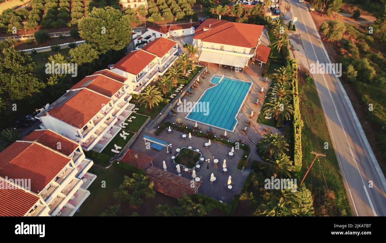 Summer resort - white buildings with orange roofs and a small hotel ...