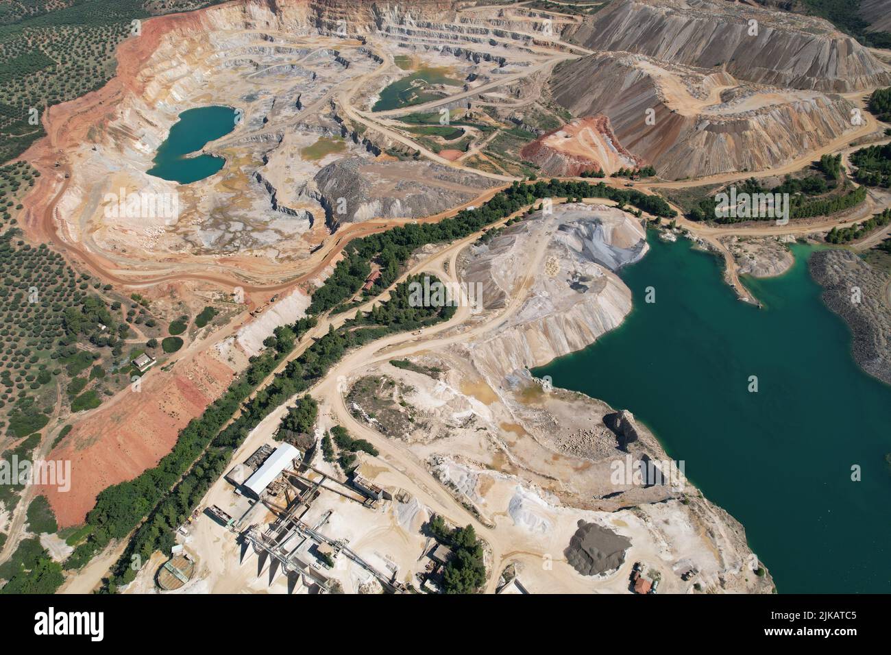 Bird's eye perspective of an open pit mine or a quarry. Human ...