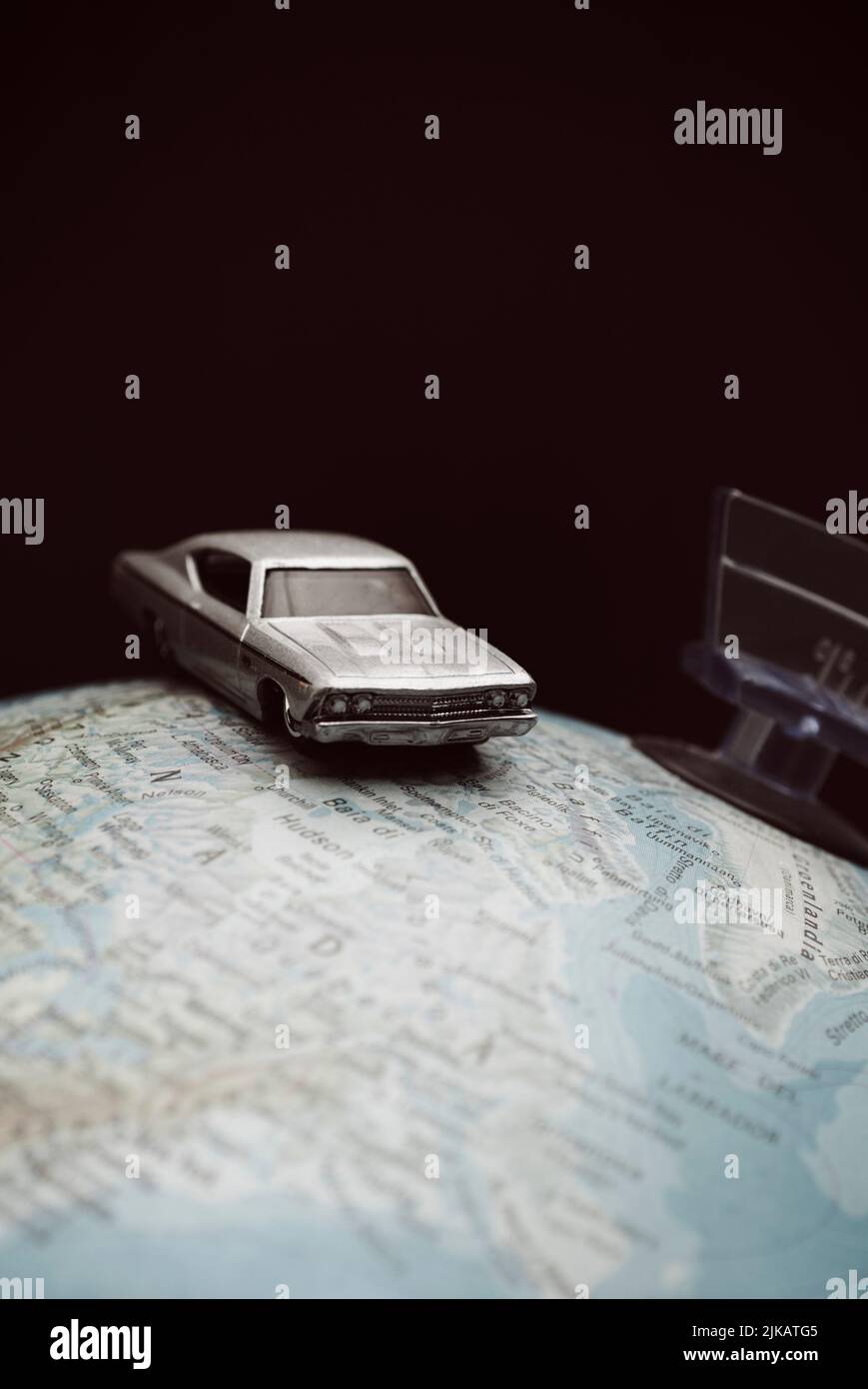 toy car on earth globe Stock Photo - Alamy