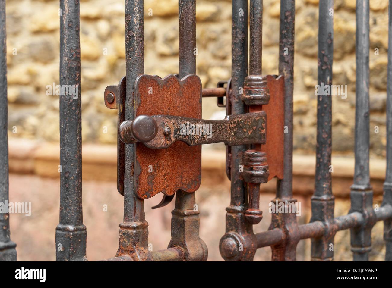 Ancient metal rusty wrought handle deadbolt (latch) of closed door of ...