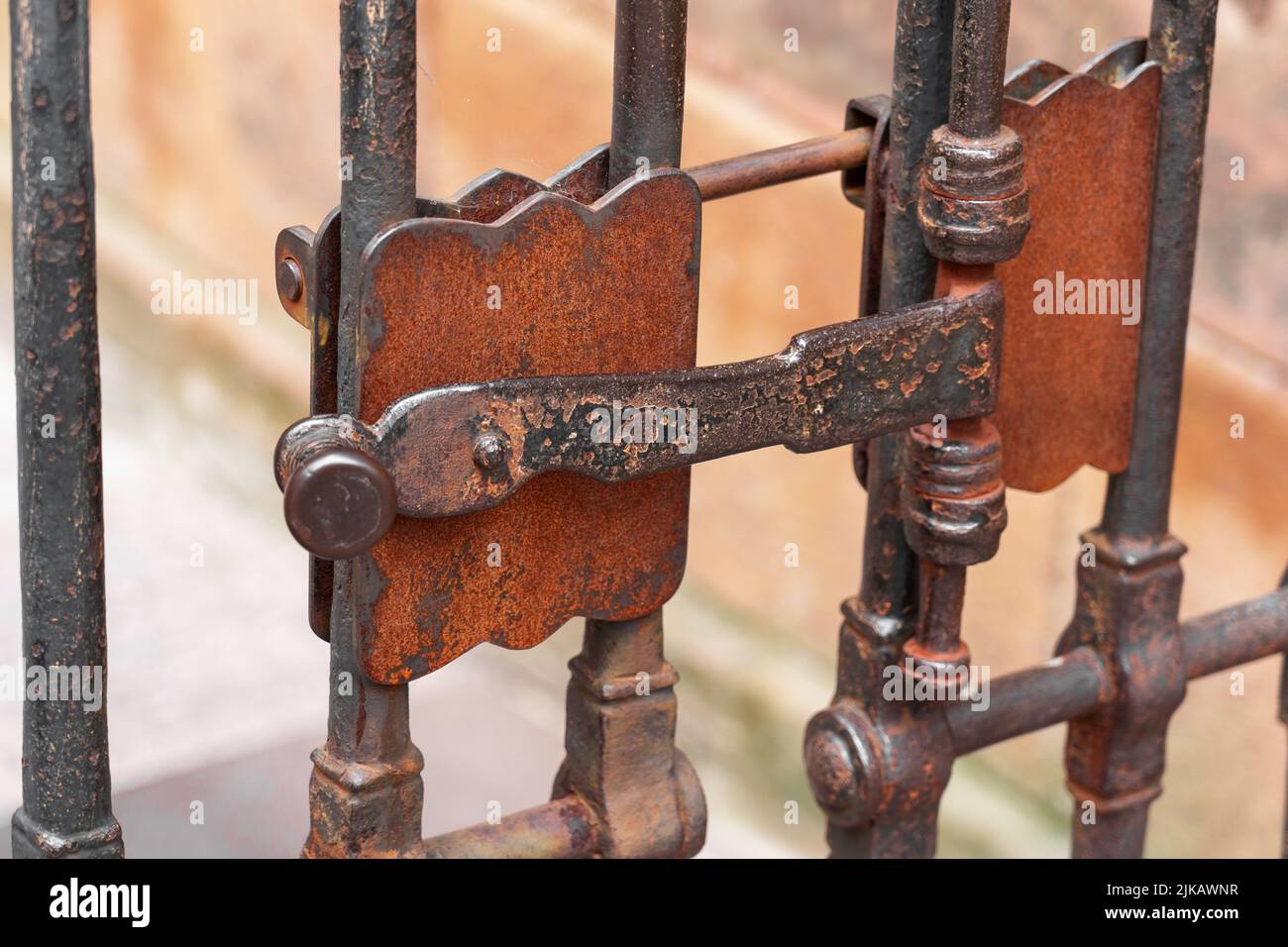 Ancient metal rusty wrought handle deadbolt (latch) of closed door of ...