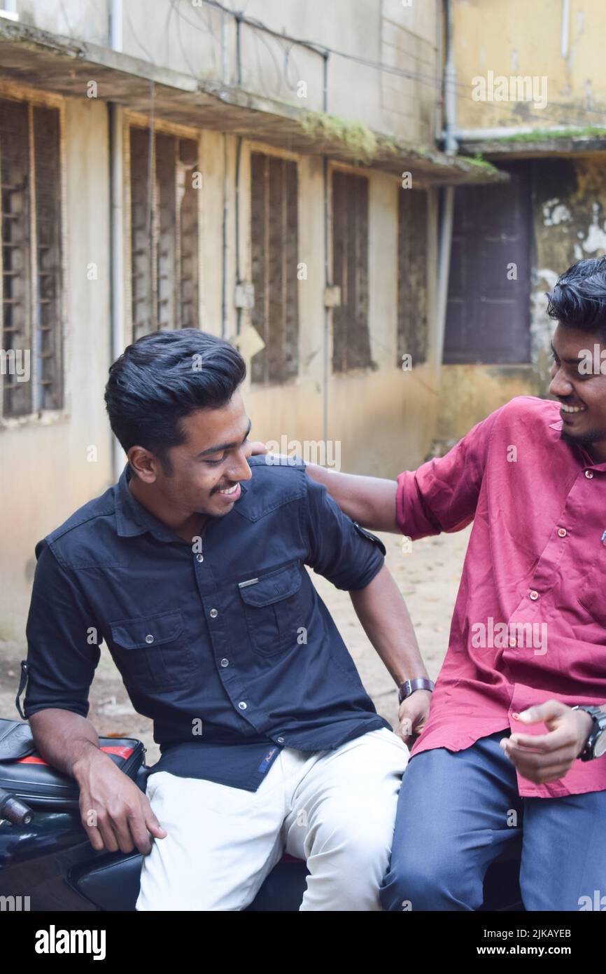 Indian young men posing for photo and smiling Stock Photo - Alamy