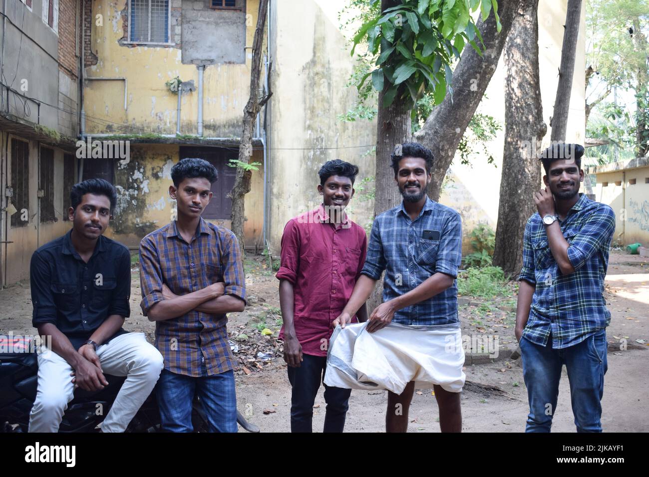 a group of Indian young men posing for photo Stock Photo - Alamy