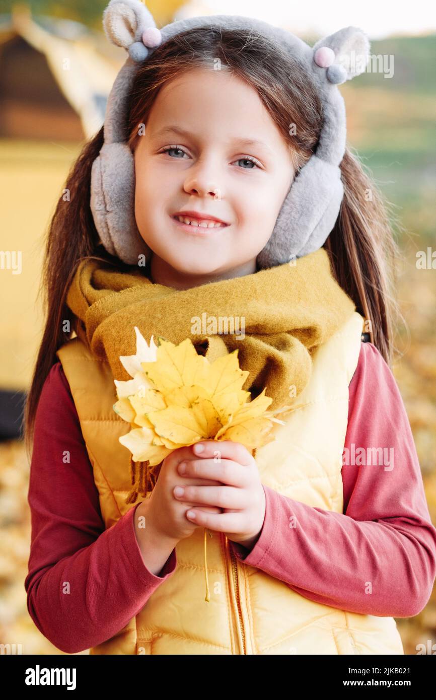 autumn season happy cute girl yellow maple leaves Stock Photo - Alamy