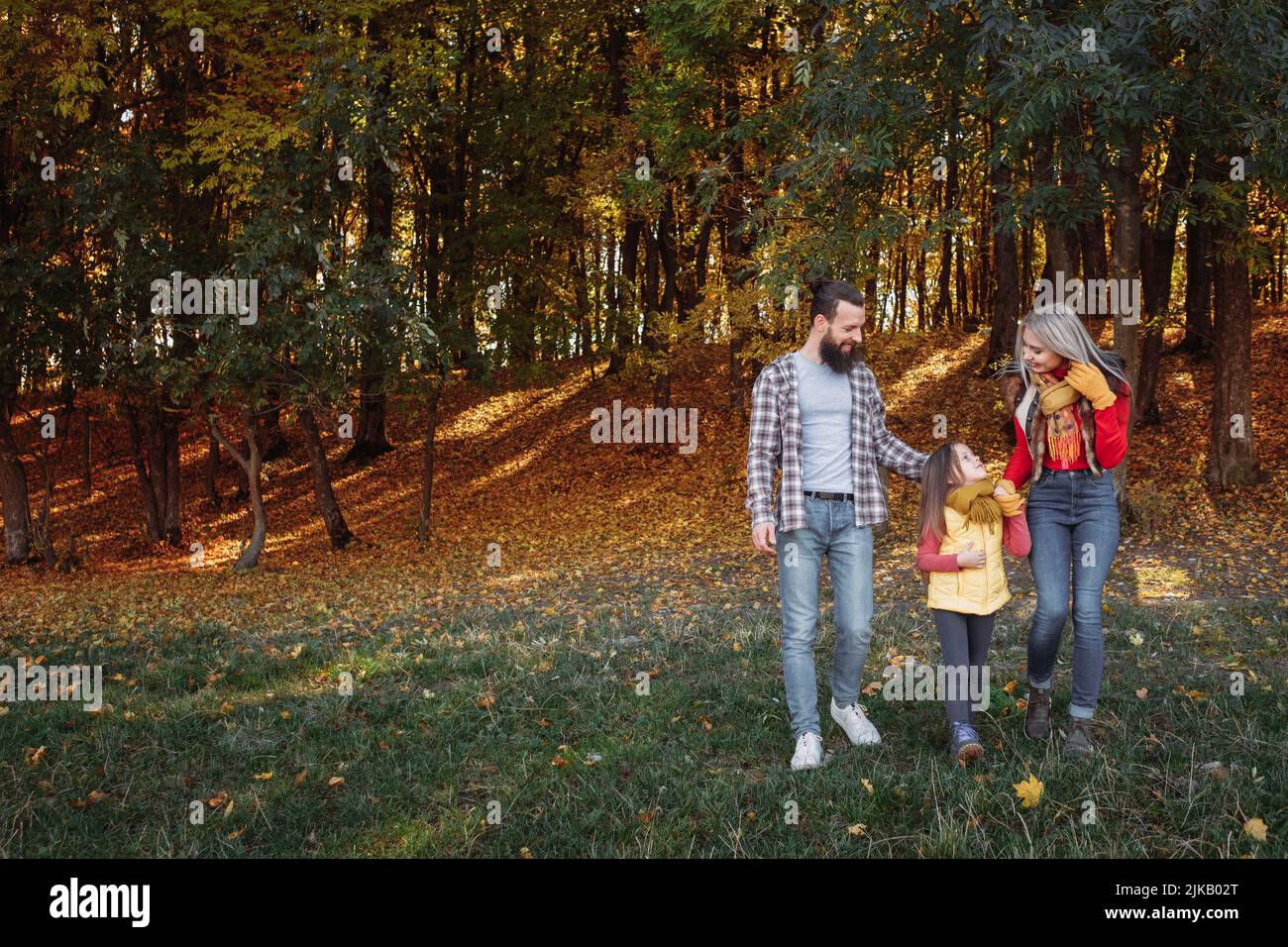 fall leisure parents daughter walking nature park Stock Photo - Alamy