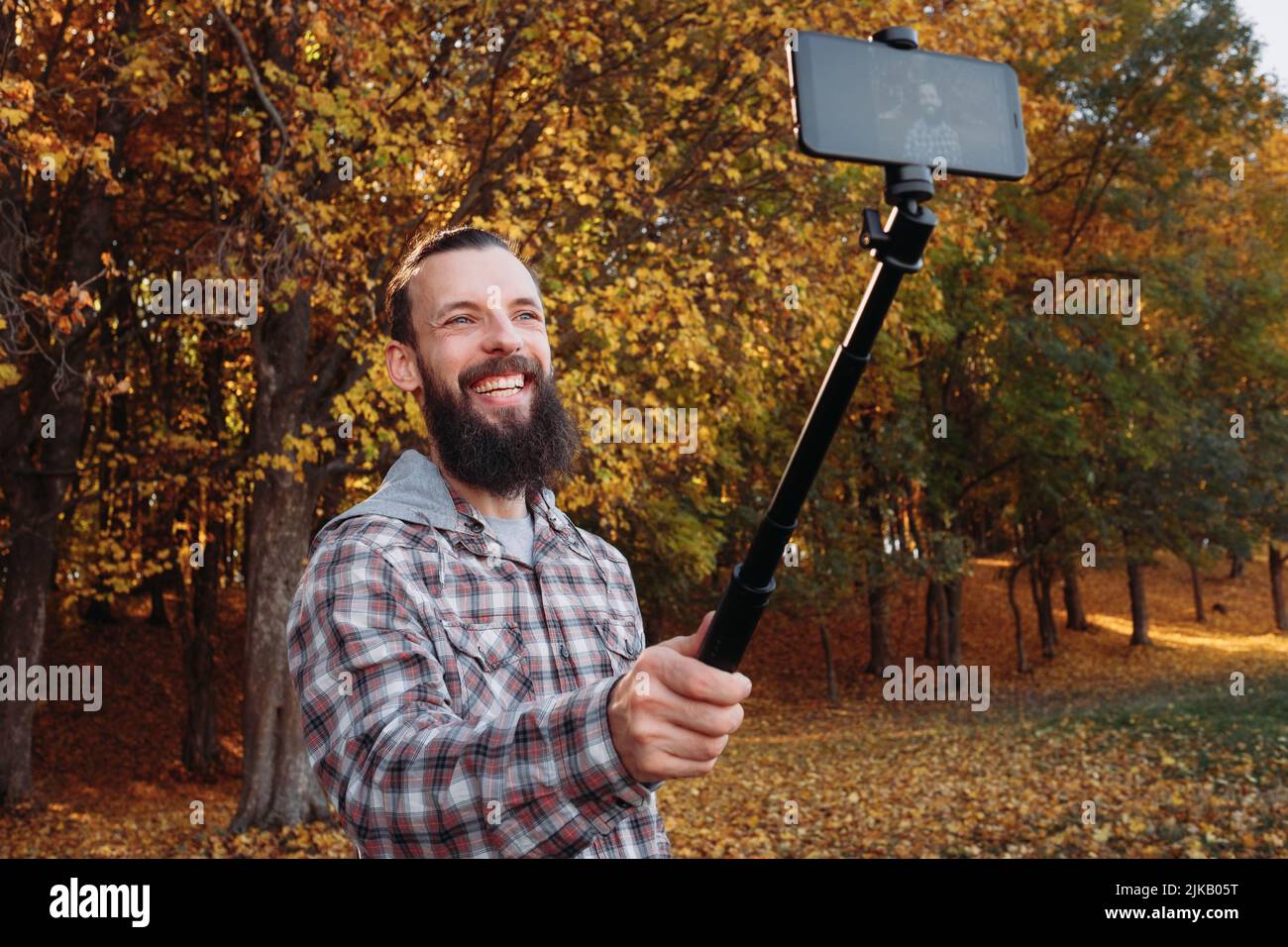 fall forest male tourist selfie nature foliage Stock Photo - Alamy