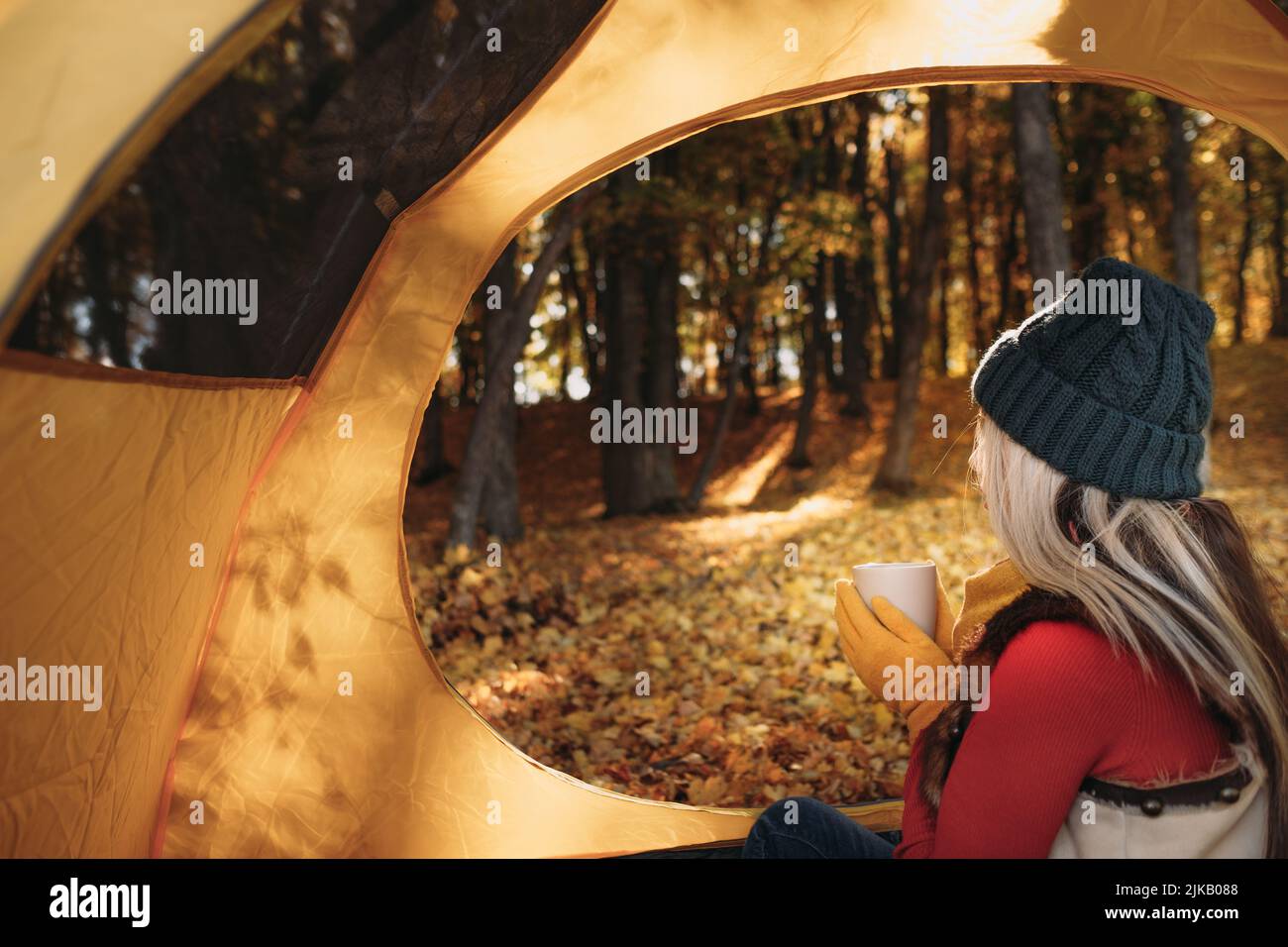 fall camping lady autumn forest golden foliage Stock Photo - Alamy