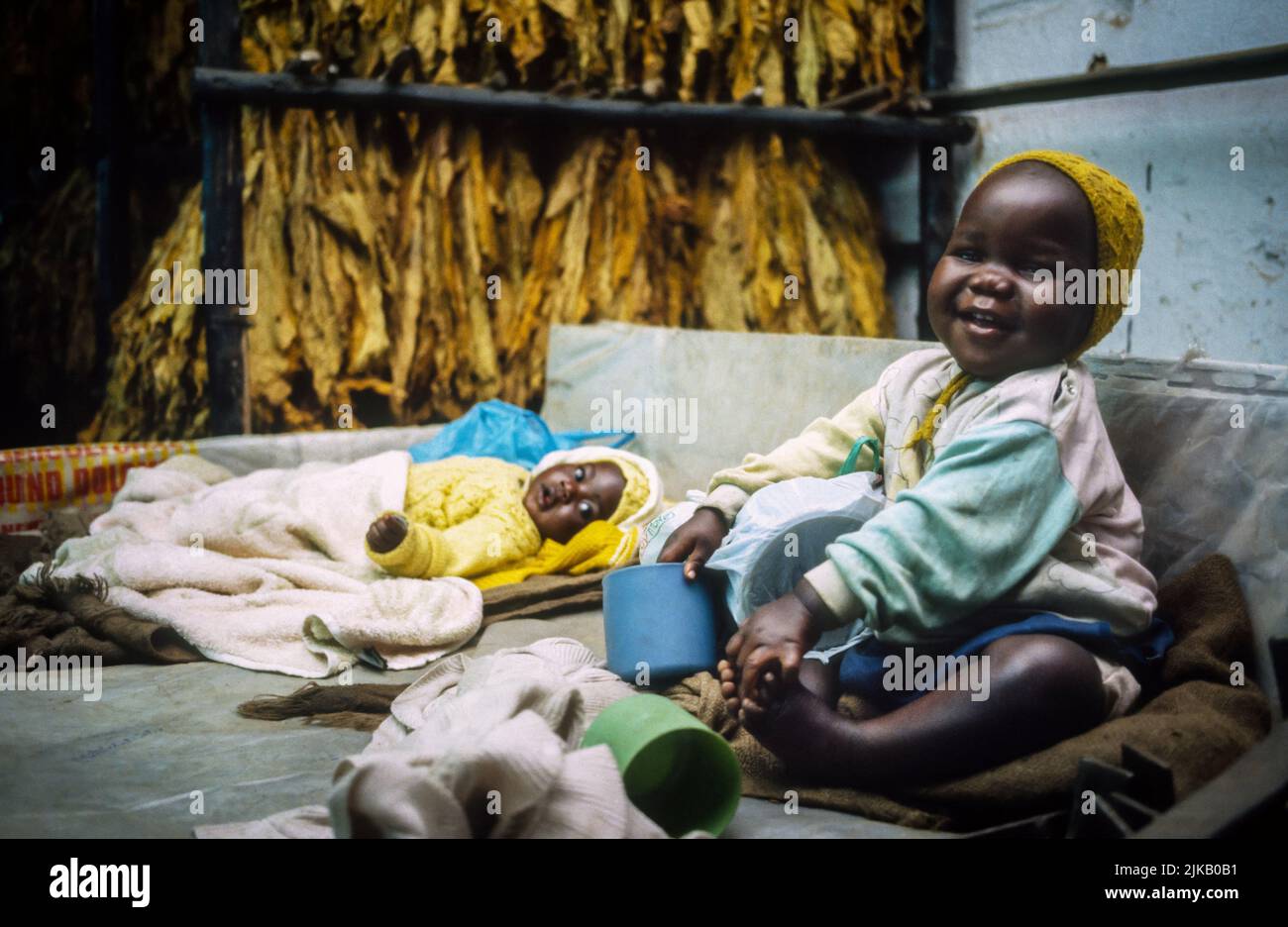 Babies at a makeshift nursery at a Tacocco factory whilst mother is ...