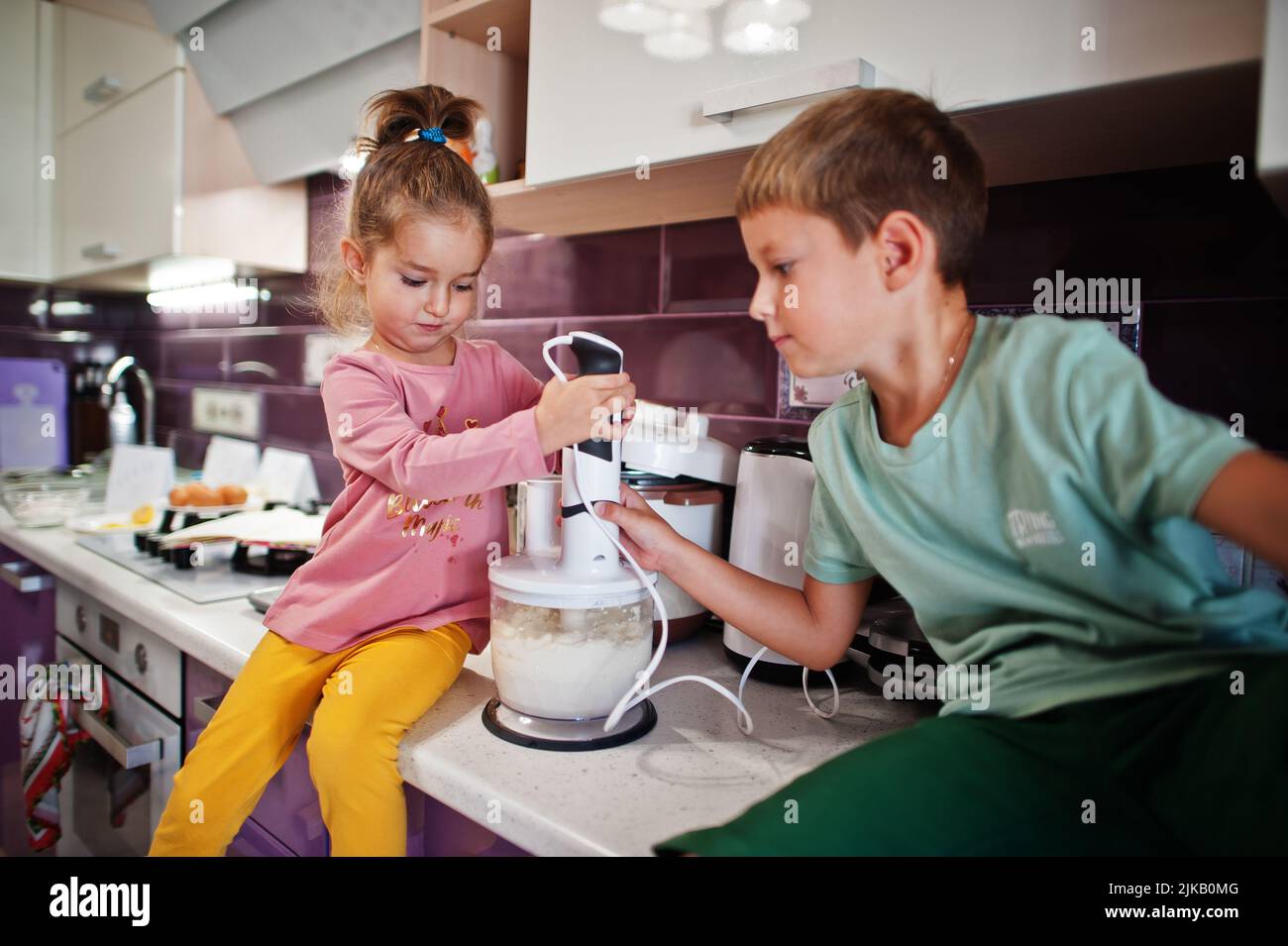 Kids cooking at kitchen, happy children's moments Stock Photo - Alamy