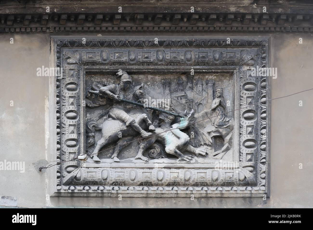 Closeup to old whitened and damaged bas relief of Saint George and ...