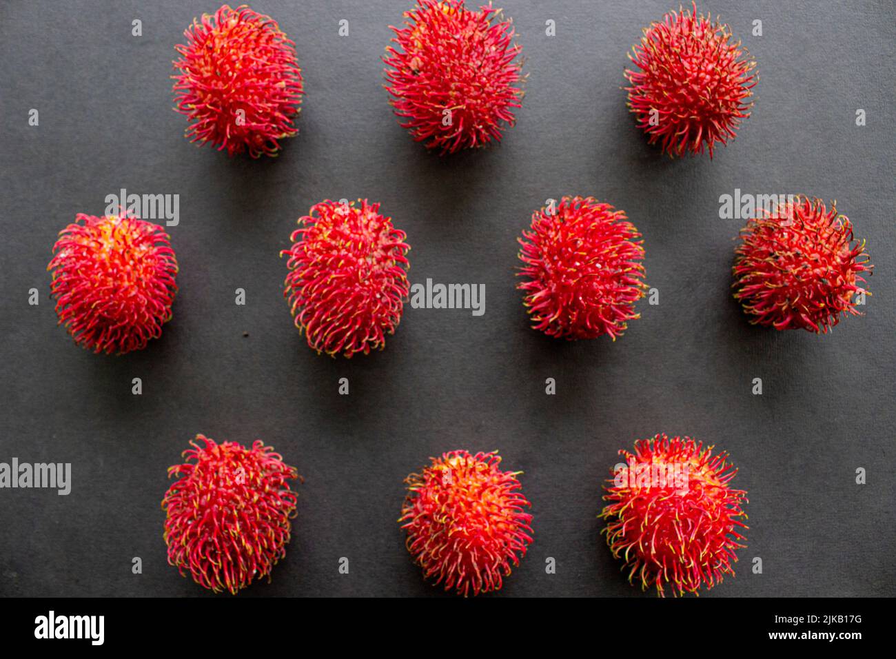 rambutan, sweet red rambutan fruit isolated on black background Stock ...