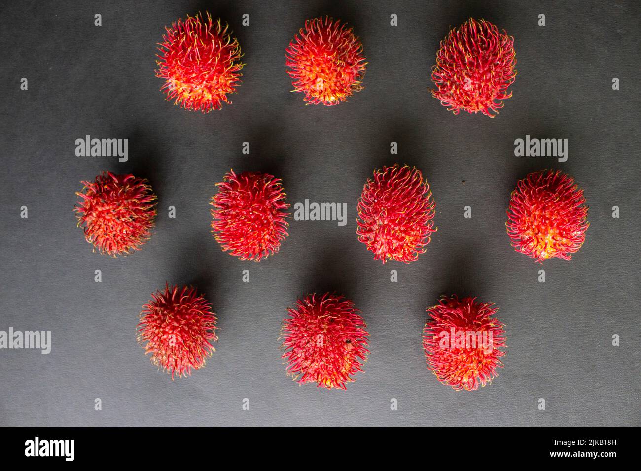 rambutan, sweet red rambutan fruit isolated on black background Stock ...