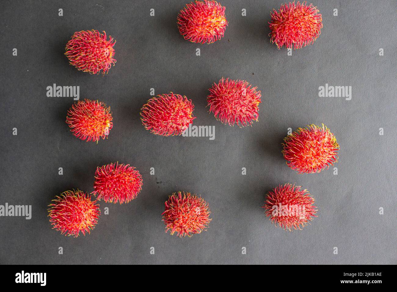 rambutan, sweet red rambutan fruit isolated on black background Stock ...