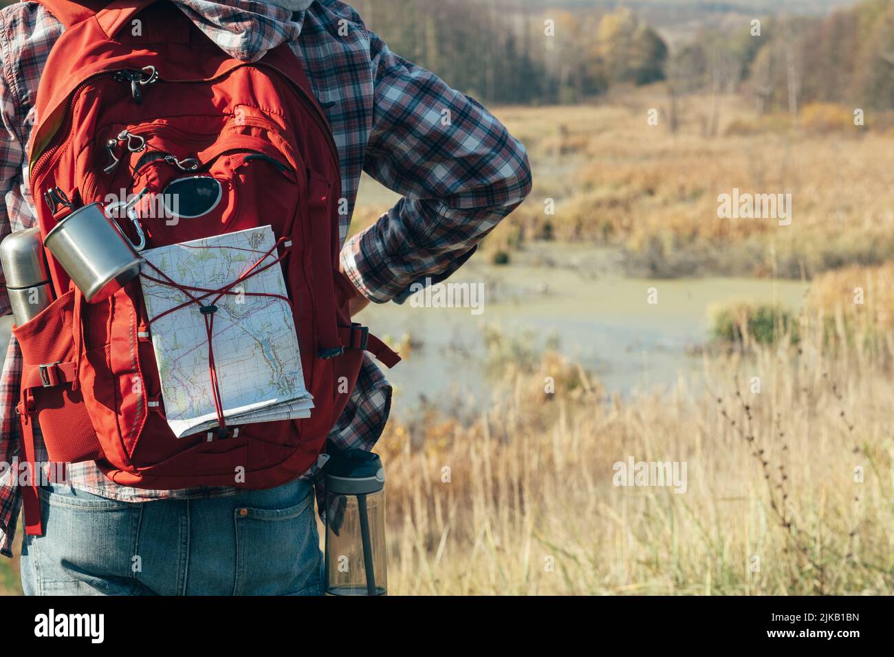 hiking tourism man backpack swamp fall landscape Stock Photo - Alamy