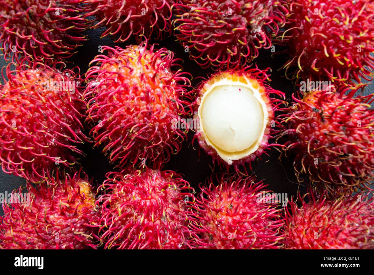rambutan, sweet red rambutan fruit isolated on black background Stock ...