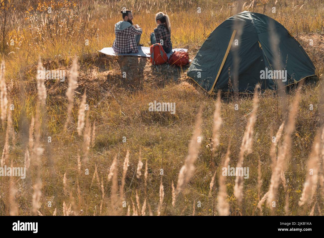 romantic camping couple tent meadow fall nature Stock Photo - Alamy