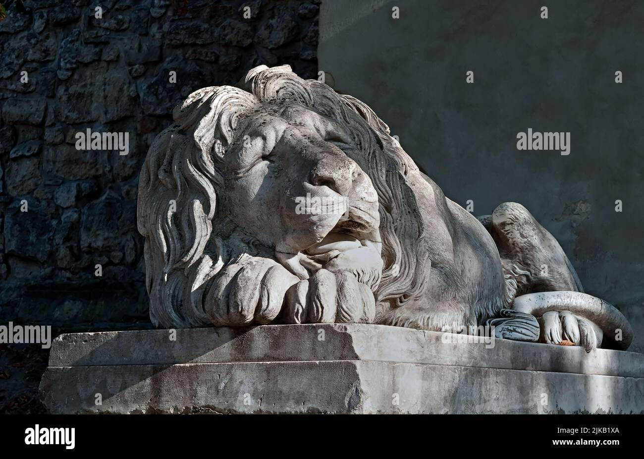 The sleeping lion sculpture in Lviv, Ukraine Stock Photo - Alamy