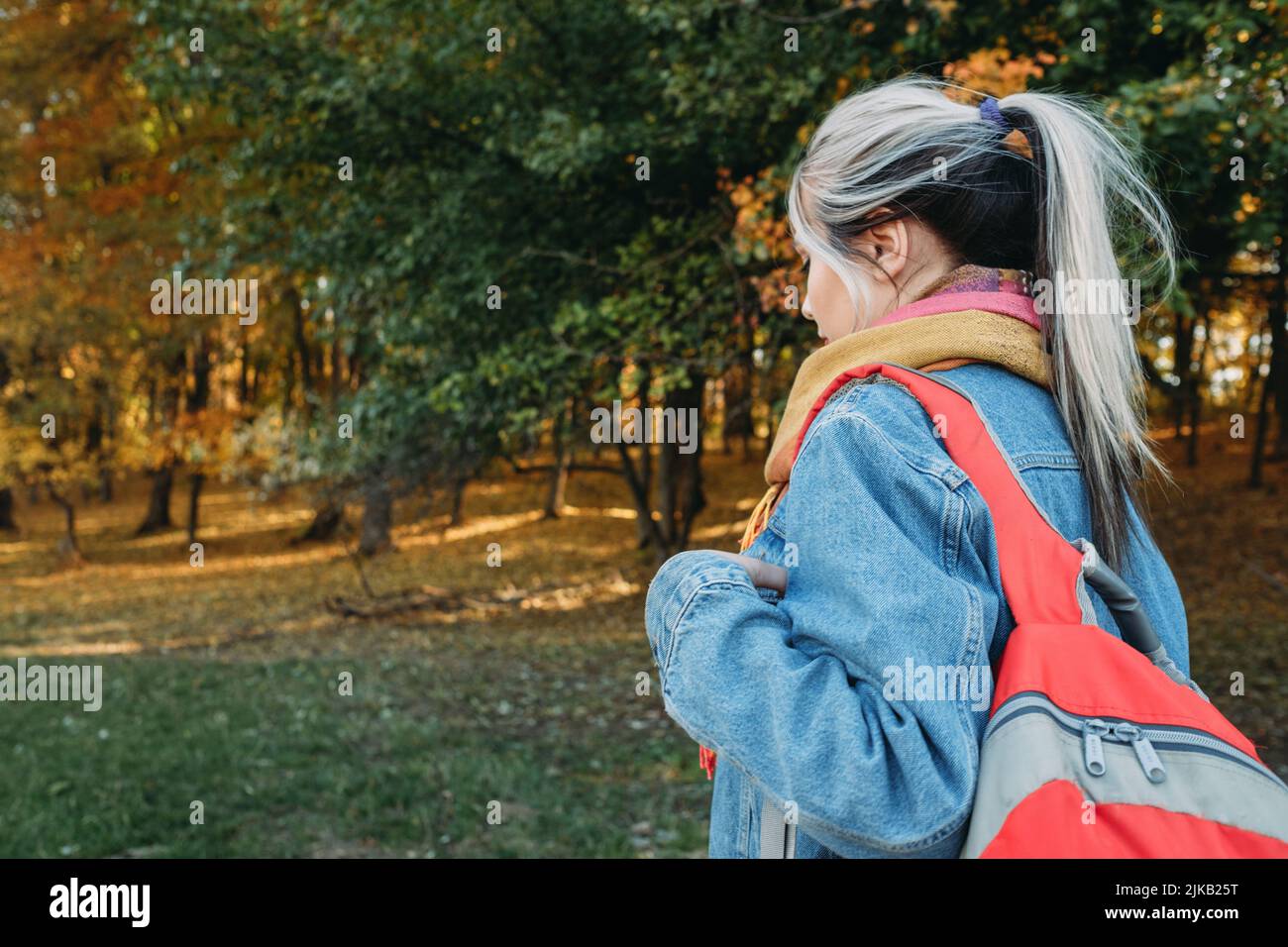 country tourism lady backpack autumn nature park Stock Photo - Alamy