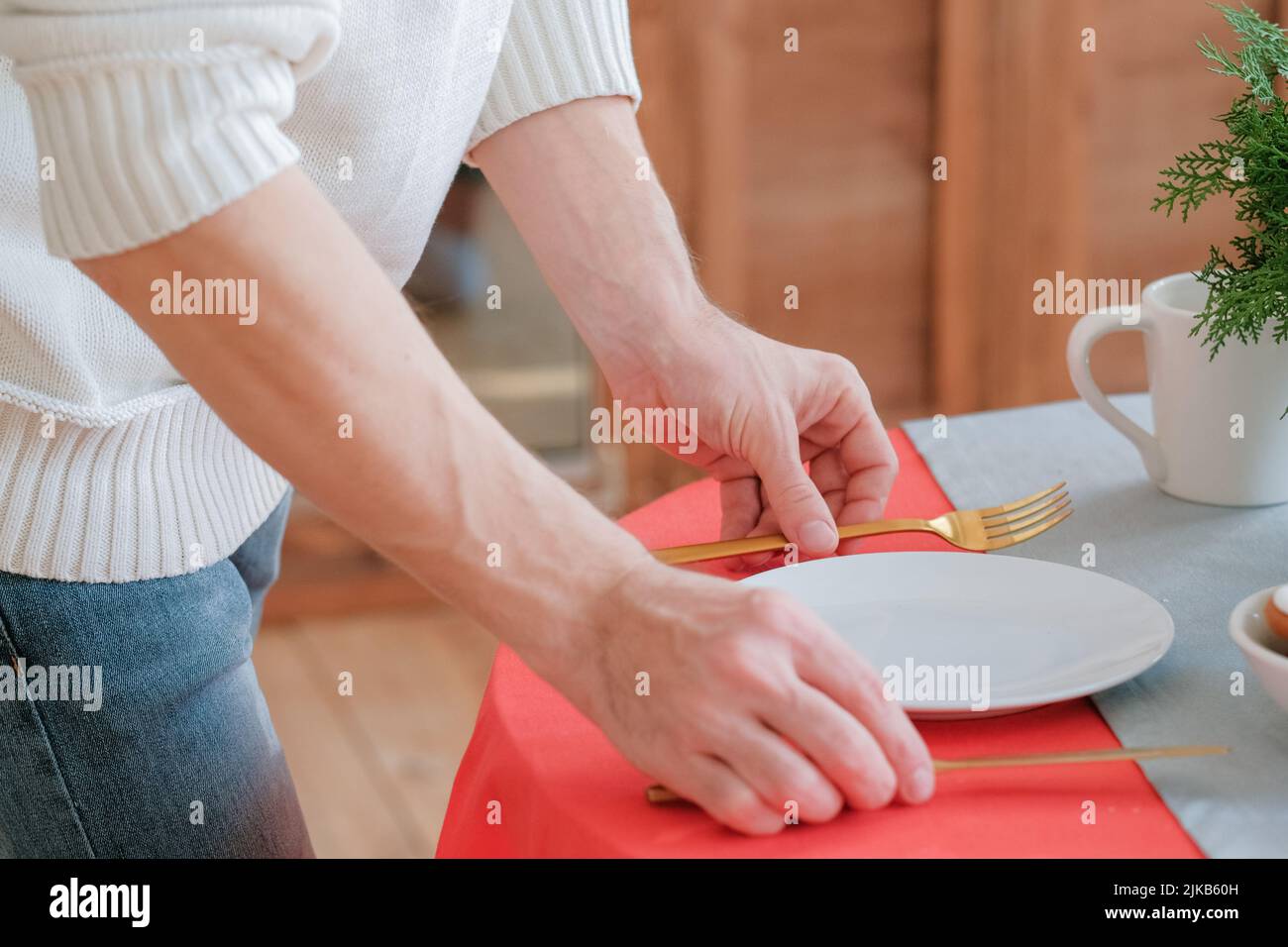 Man Setting The Table