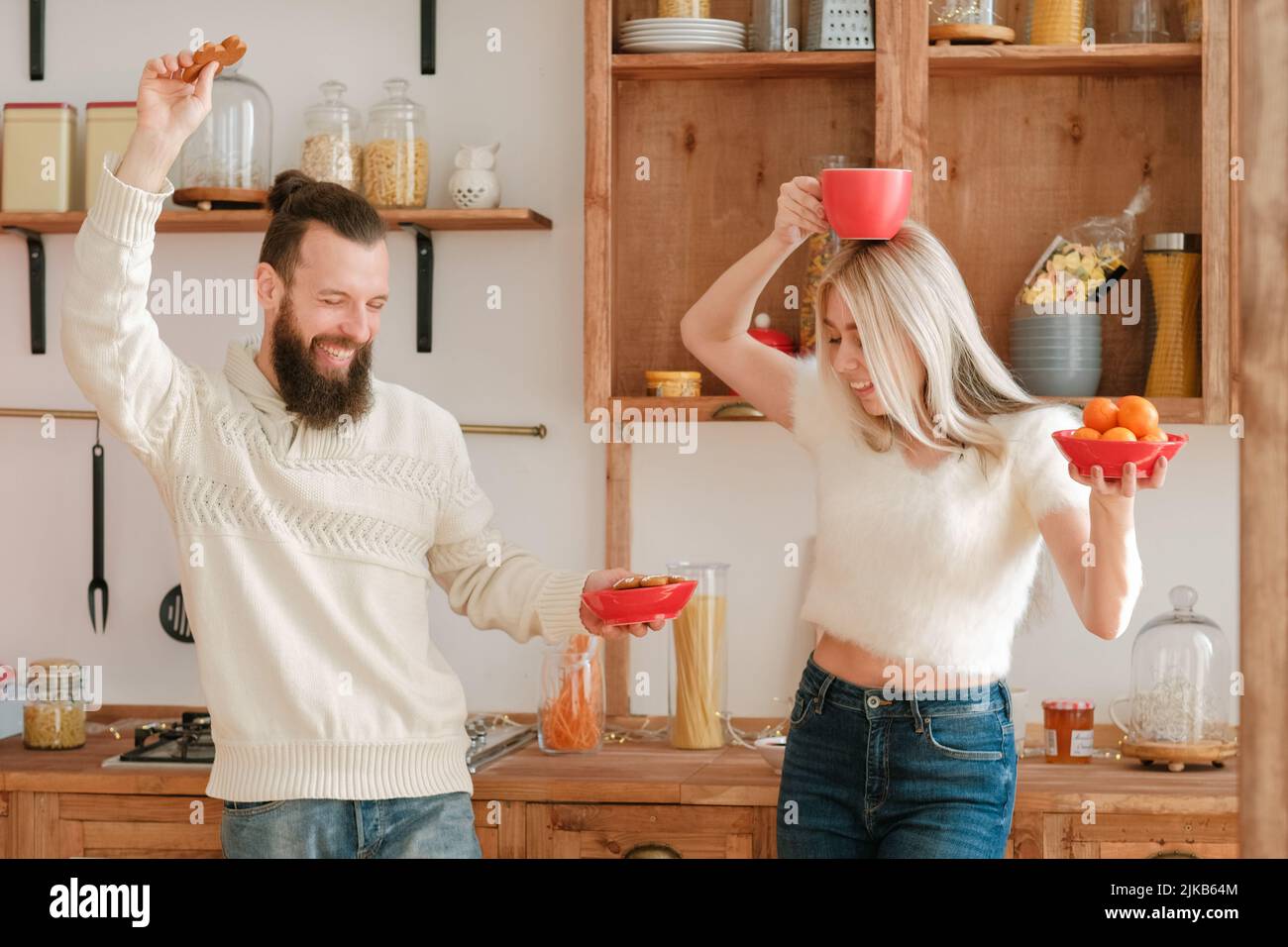 home kitchen disco couple fun dancing kitchen Stock Photo - Alamy