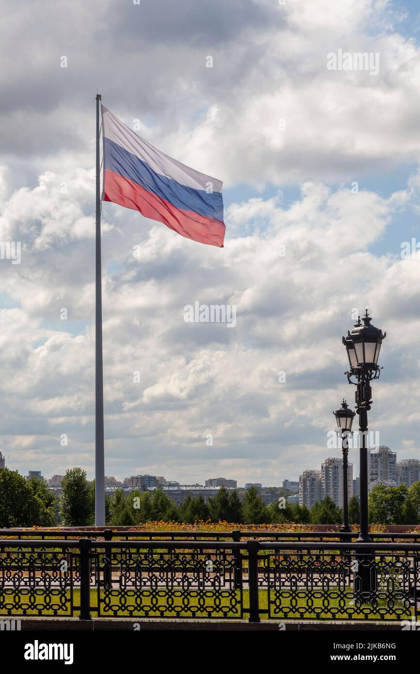 Large flag of Russia flutters in the wind in Victory Park in Moscow ...