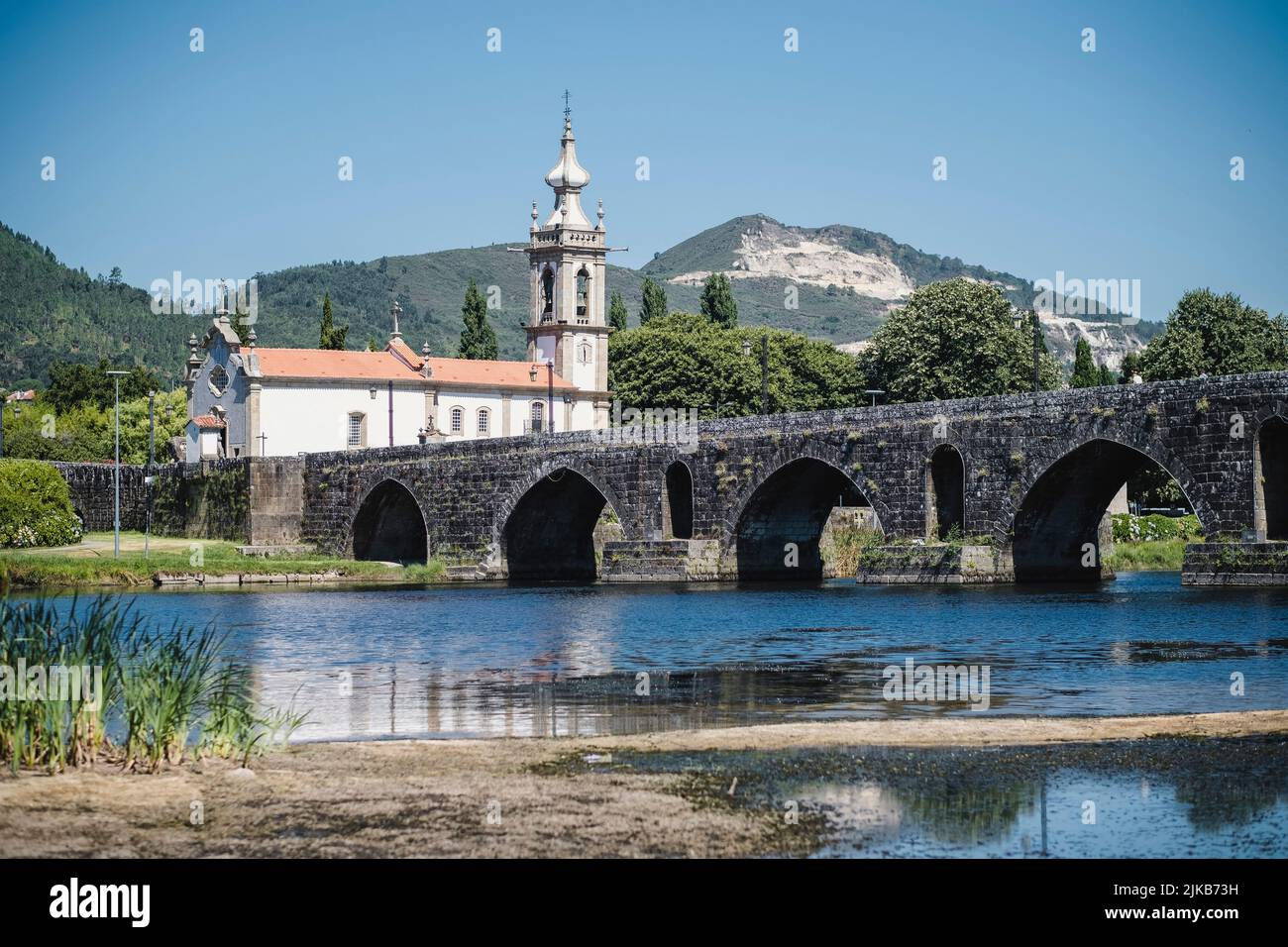 View of the long medieval bridge over the Lima river, Ponte de Lima ...