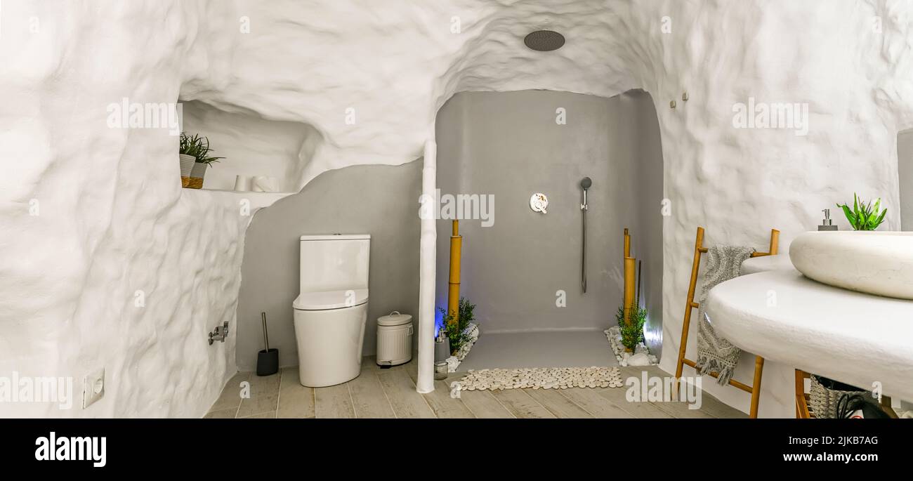 Bathroom inside modern cave for rural tourism Stock Photo - Alamy