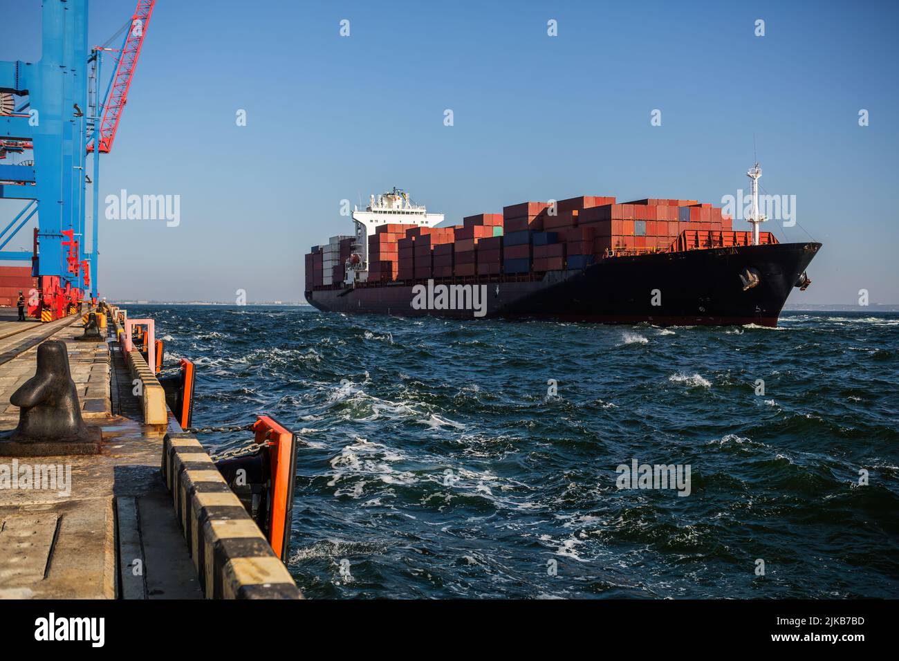 Container ship in port at container terminal. Ships of container ships ...